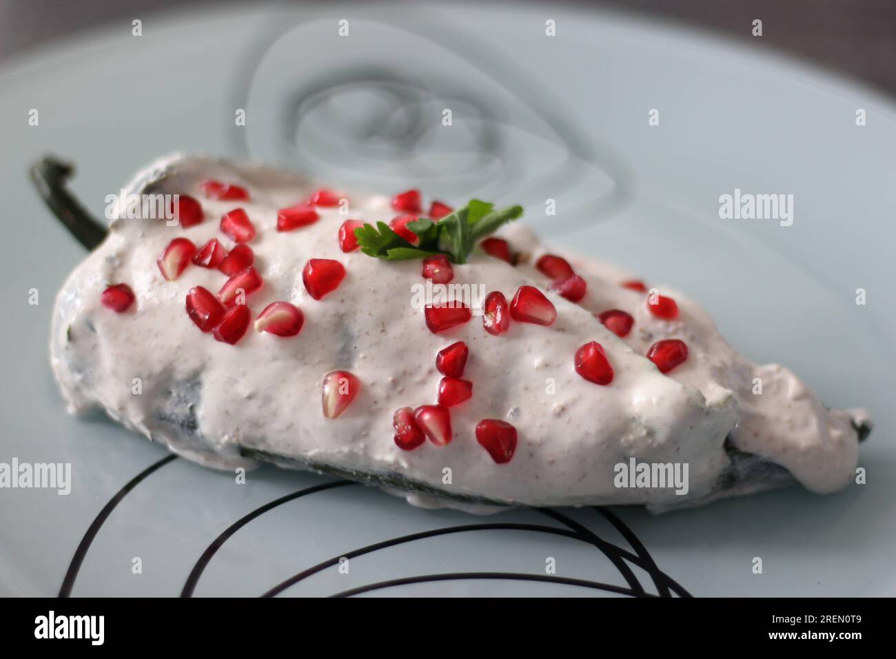 Close-up chiles rellenos en nogada, traditional Mexican gourmet food ...