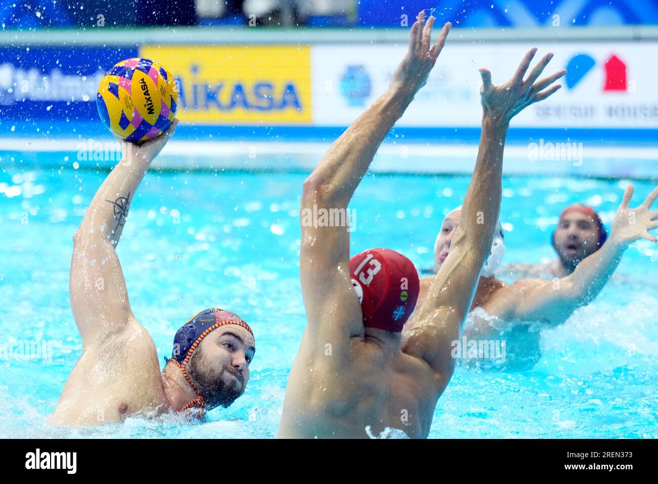 Spain's Roger Tahull, left, throws the ball to goal against Serbia ...