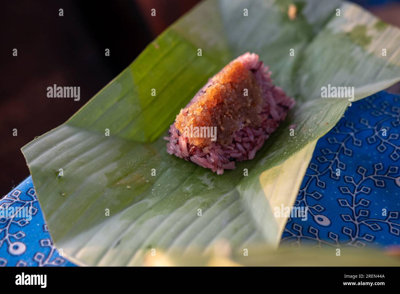 Black sticky rice, served on banana leaf Stock Photo - Alamy