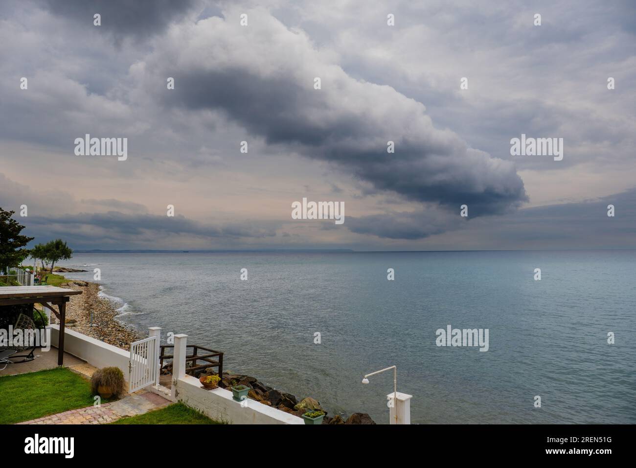 Beautiful view of calm sea with stormy clouds Stock Photo - Alamy