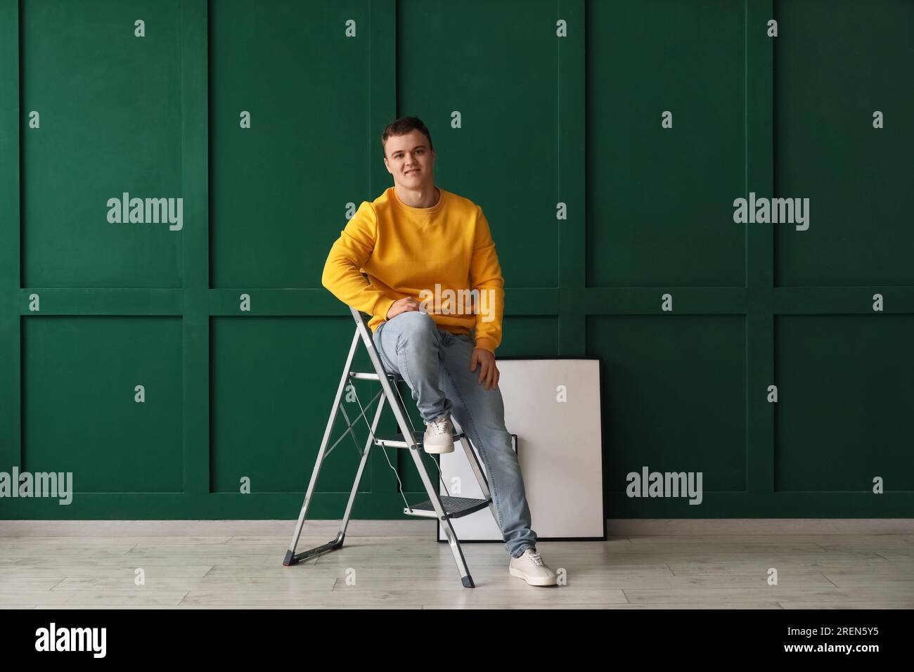 Man sitting on ladder hi-res stock photography and images - Alamy