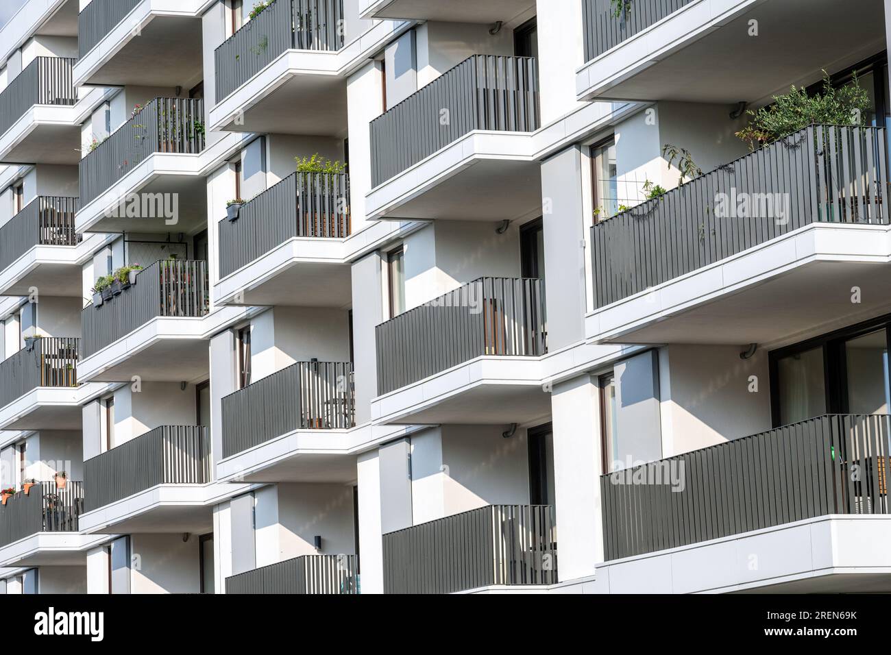 Detail of the facade of a white modern residential building seen in ...