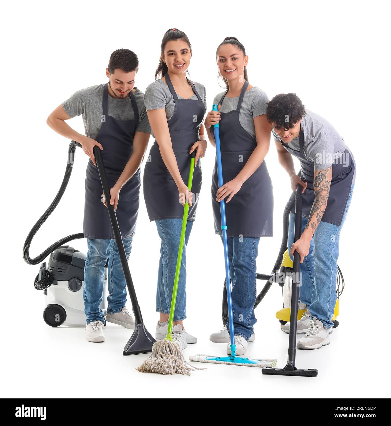 Young janitors with cleaning supplies on white background Stock Photo ...