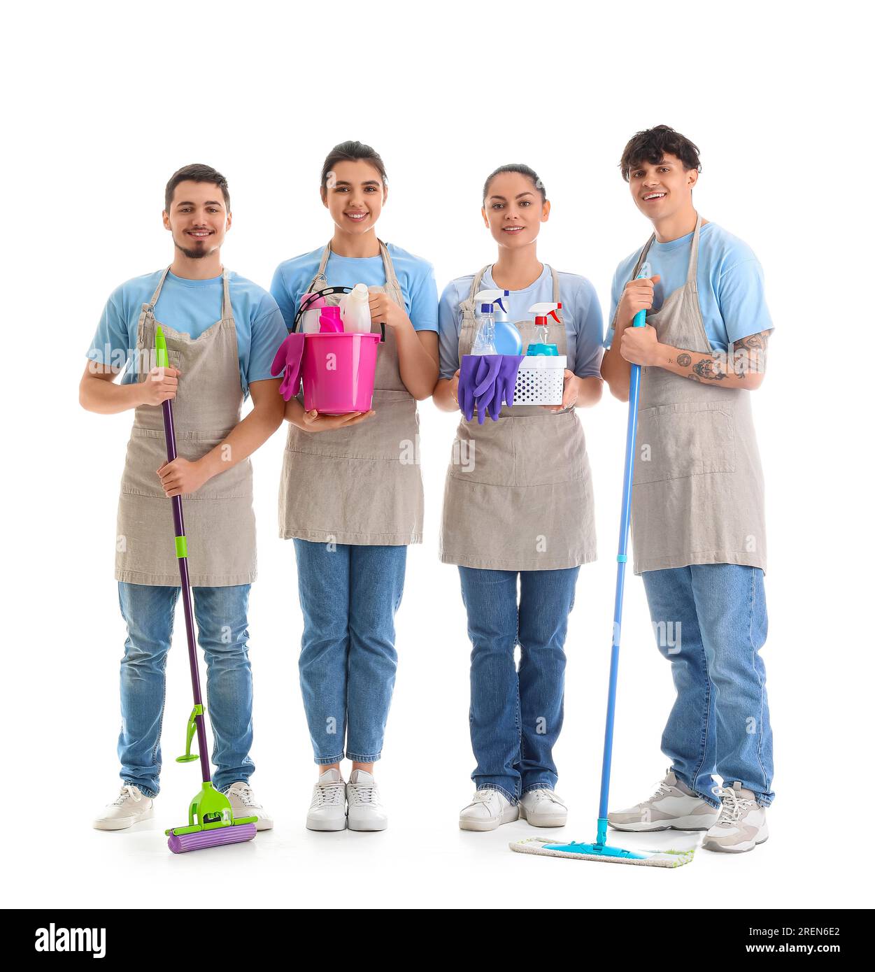 Young janitors with cleaning supplies on white background Stock Photo ...