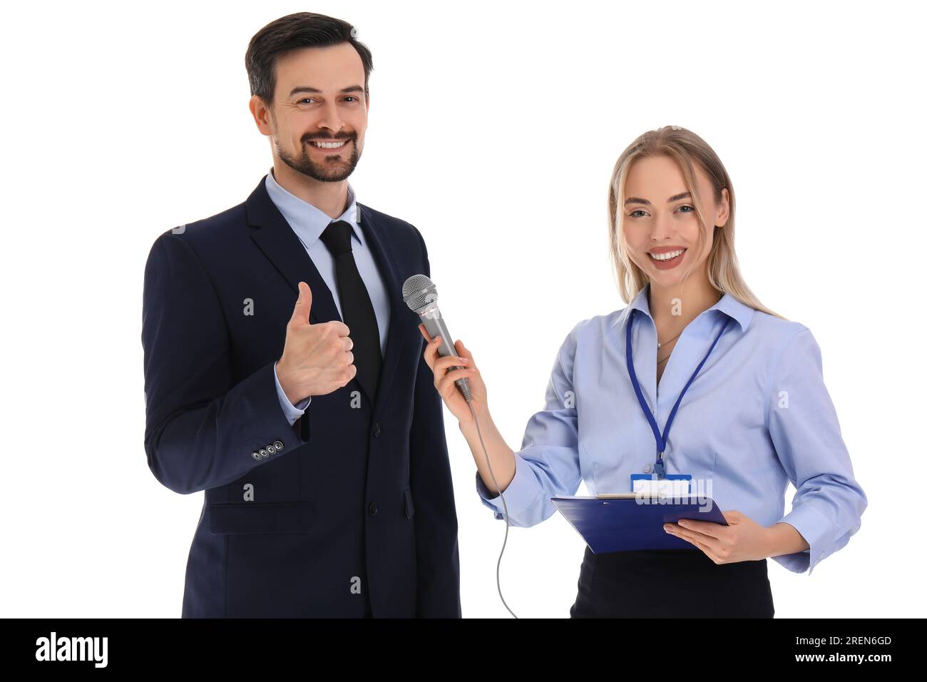 Female journalist with microphone having an interview with businessman ...