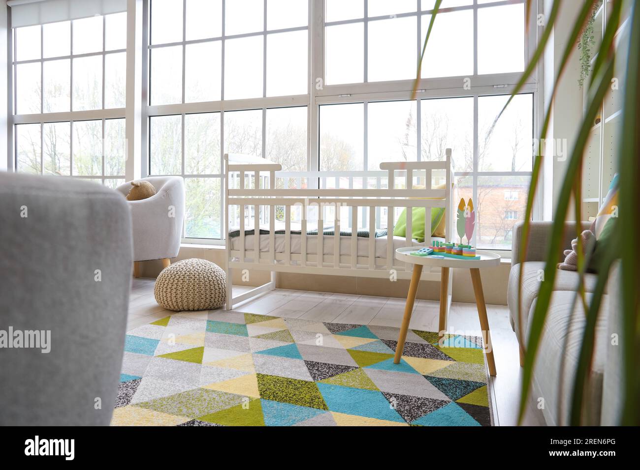 Stylish interior of children's room with baby bed and big windows Stock ...