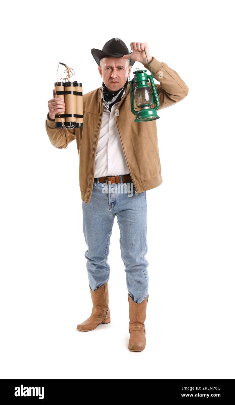Mature cowboy with explosive and lantern on white background Stock ...