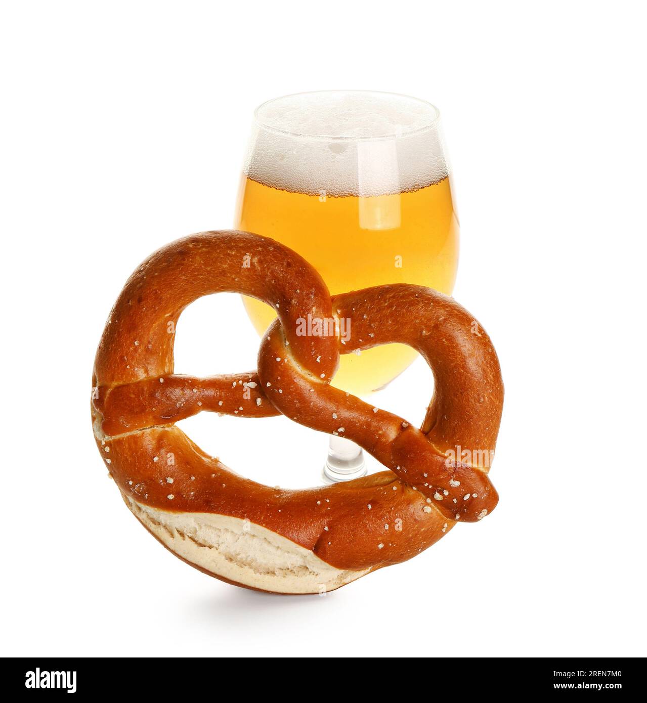 Glass of cold beer and pretzel on white background. Oktoberfest ...