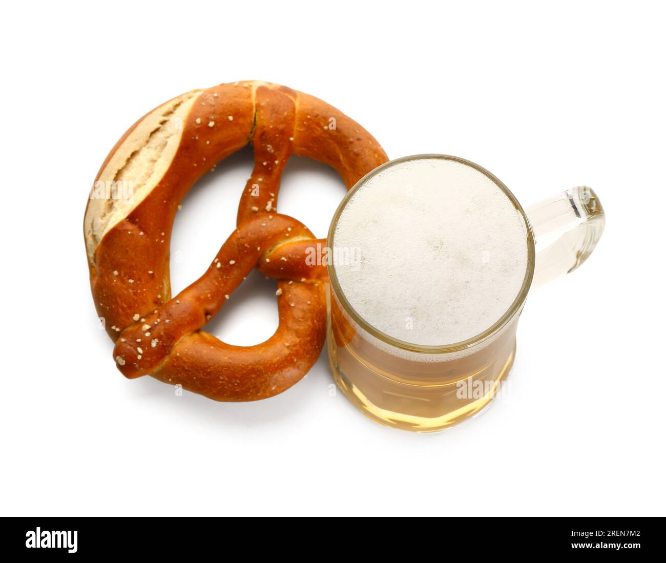 Mug of cold beer and pretzel on white background. Oktoberfest ...