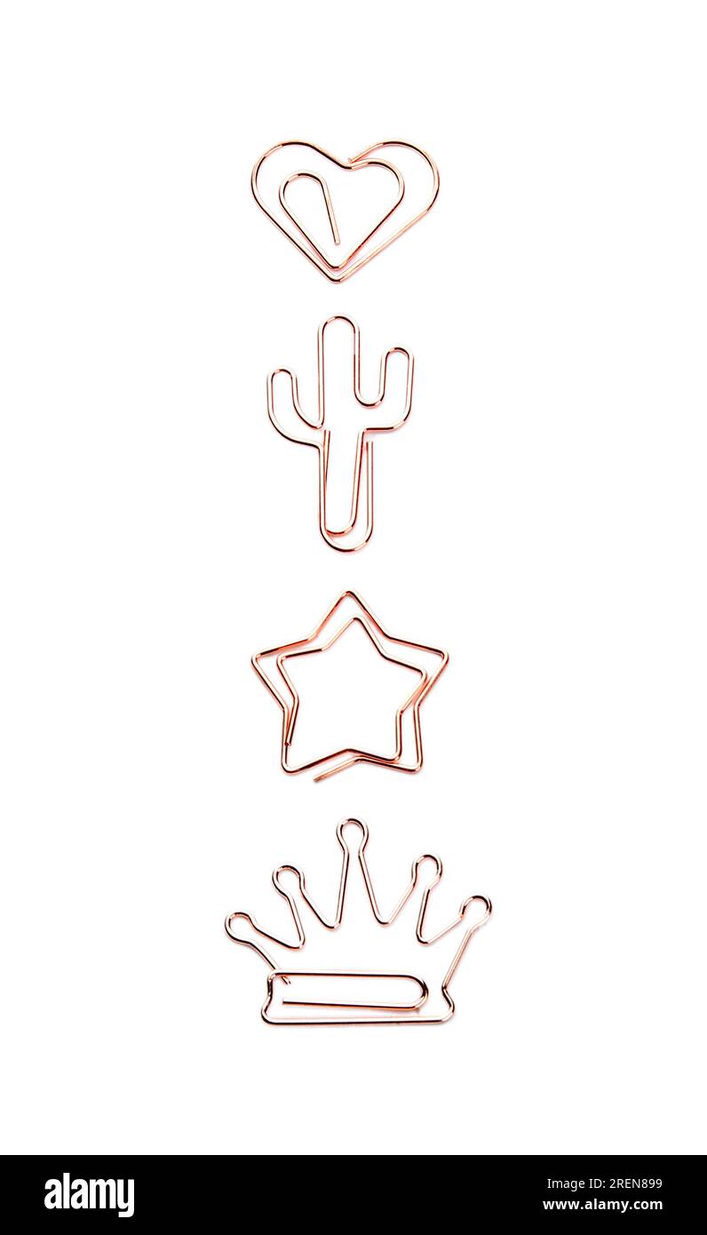Rose gold paper clips in different shapes on white background Stock ...