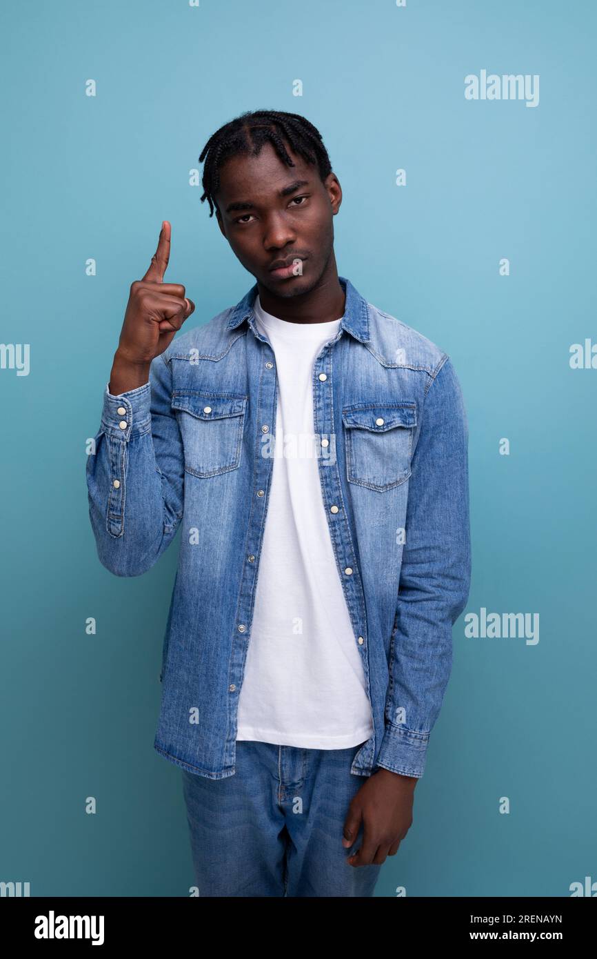 smart african man with dreadlocks on blue background Stock Photo - Alamy