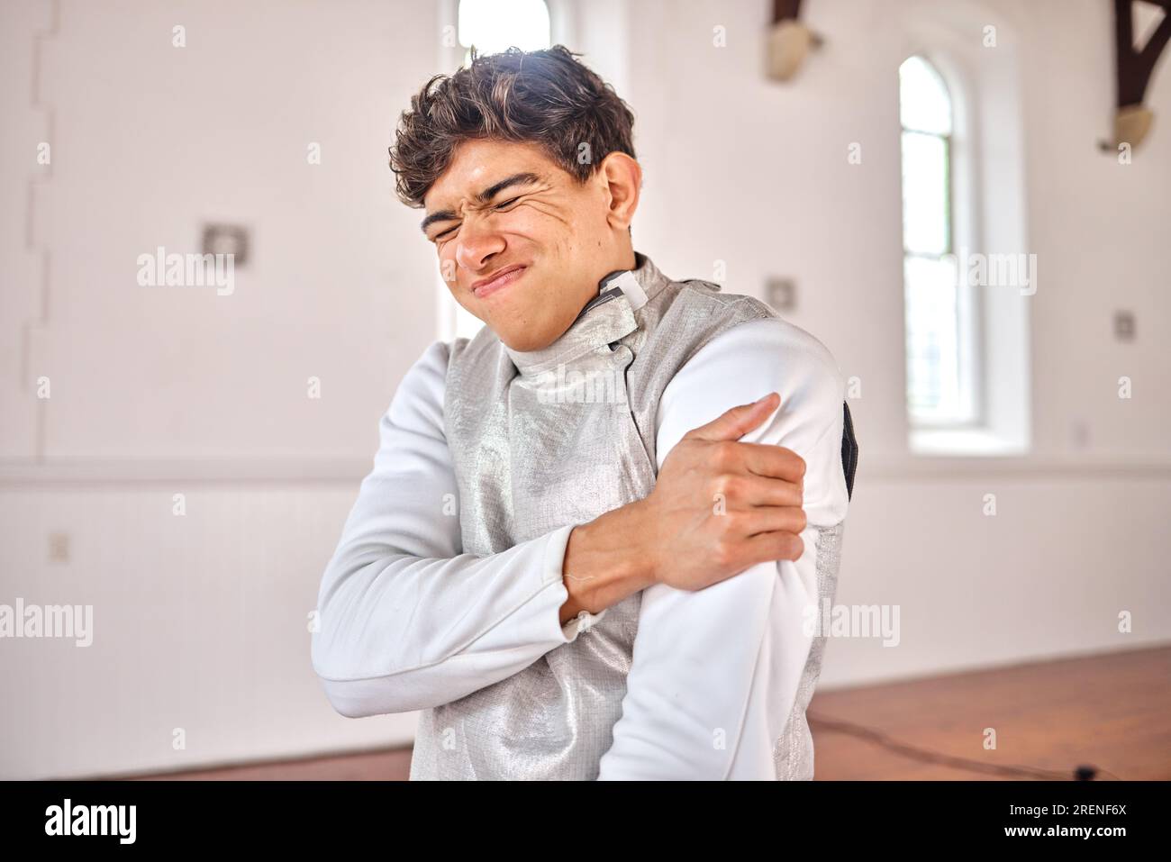 Fencing, man and shoulder pain, injury or accident after training ...