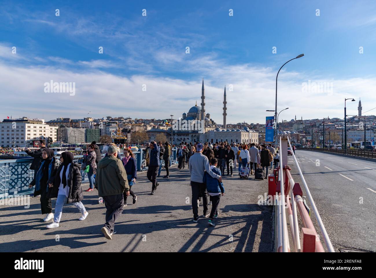 A picture of people walking the Galata Bridge and the New Mosque Stock ...