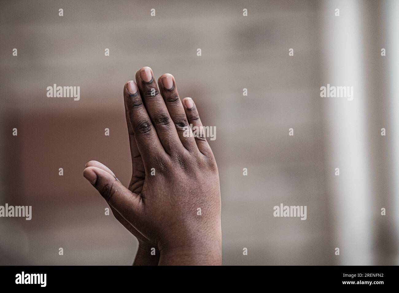 Two people praying together hi-res stock photography and images - Alamy