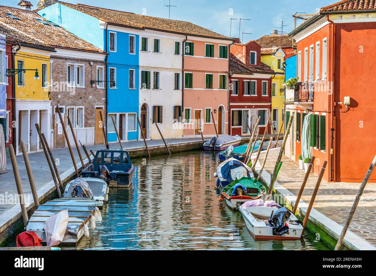 Colorful houses along the water canal in the island of Burano, Venice Stock Photo - Alamy