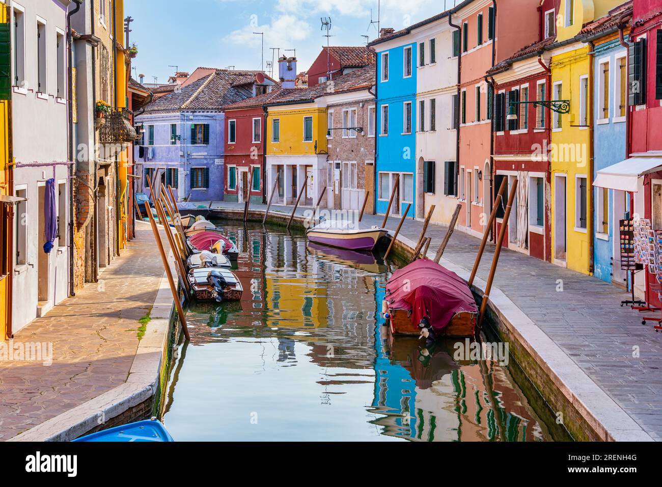 Colorful houses along the water canal in the island of Burano, Venice Stock Photo - Alamy