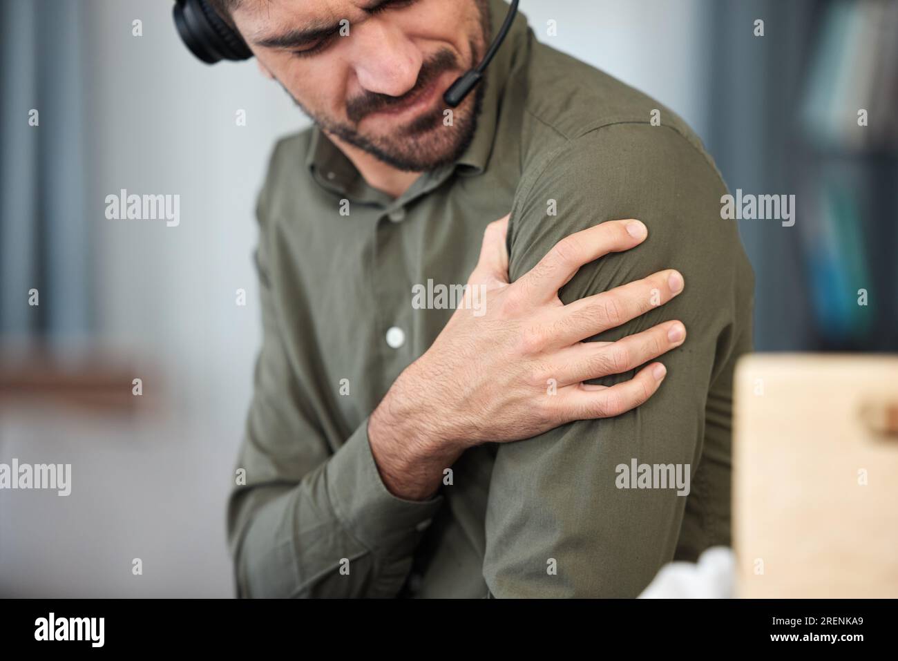 Call center man, shoulder pain and muscle in office, communication ...