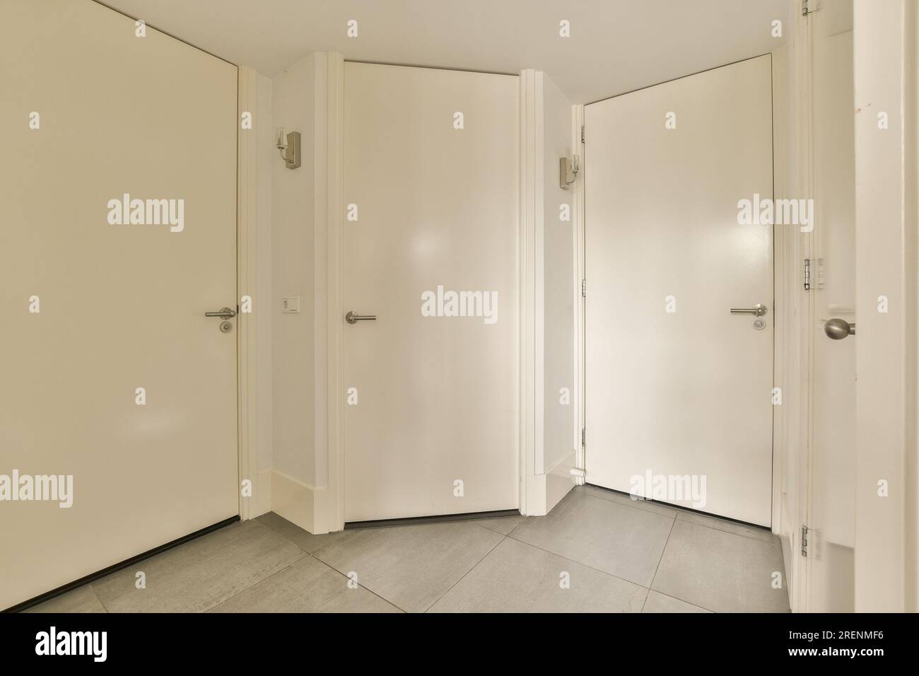 an empty room with two doors and no one door on the right side, in ...