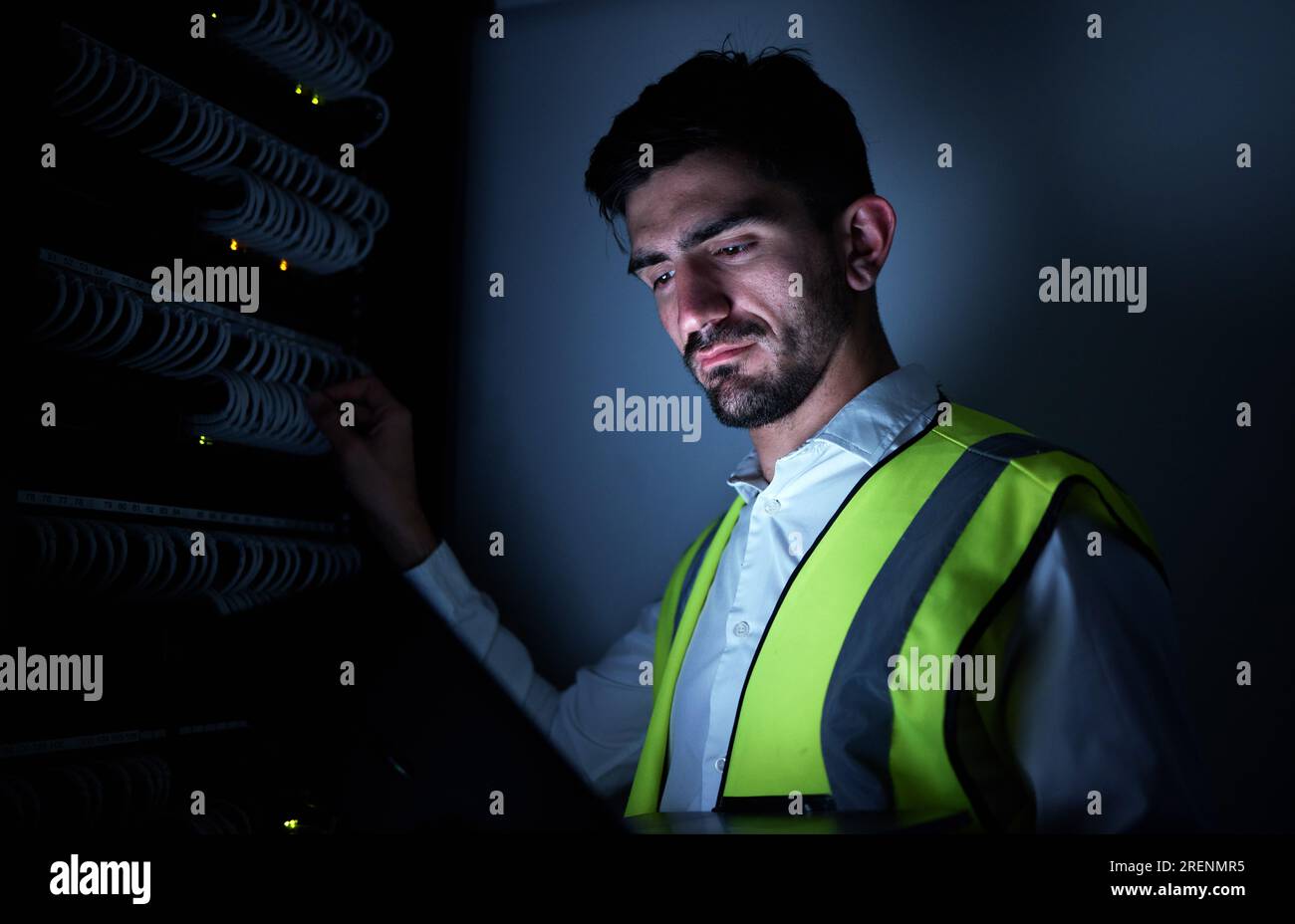 Engineer man, thinking and night in server room for information ...