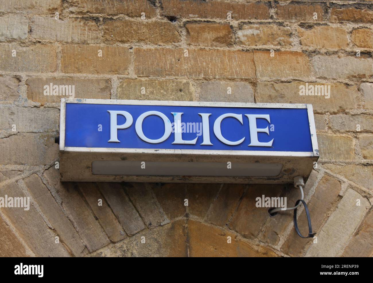 A photograph of an old blue glass Police illuminated sign on an old ...