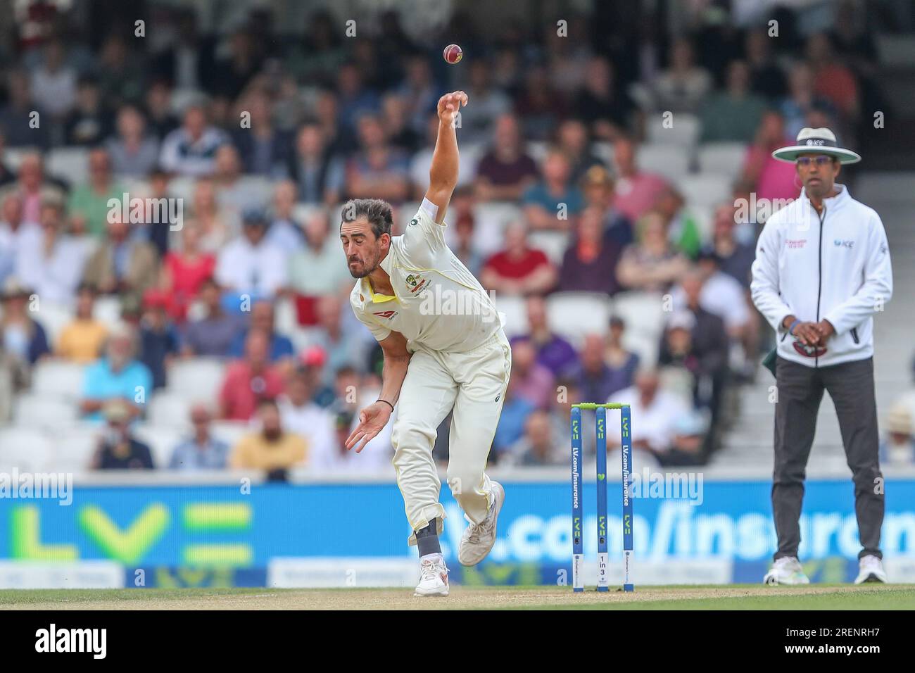Mitchell Starc of Australia delivers the first ball of the day during ...