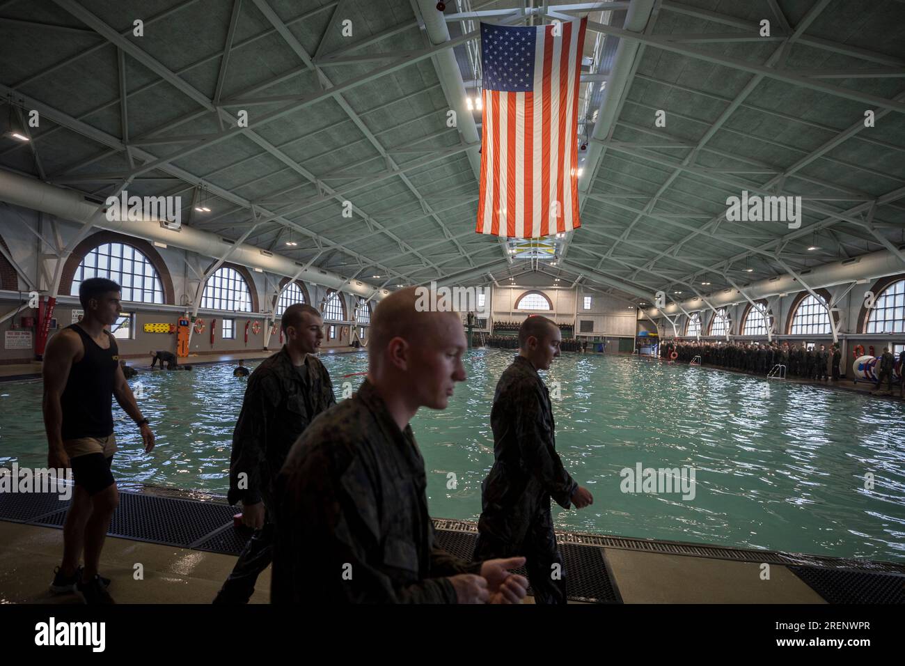 A group of male U.S. Marine Corps recruits walk past the Marine Corps ...