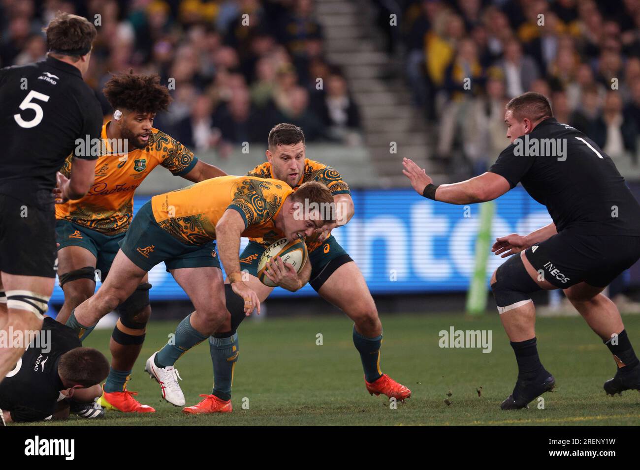 Australia's Andrew Kellaway , center, charges toward New Zealand's ...