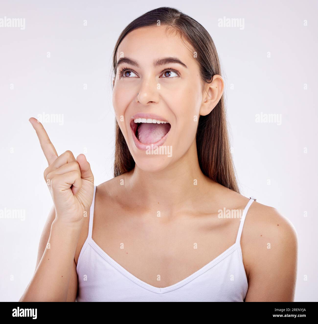 Pointing, surprise and woman excited, announcement and happiness on a ...