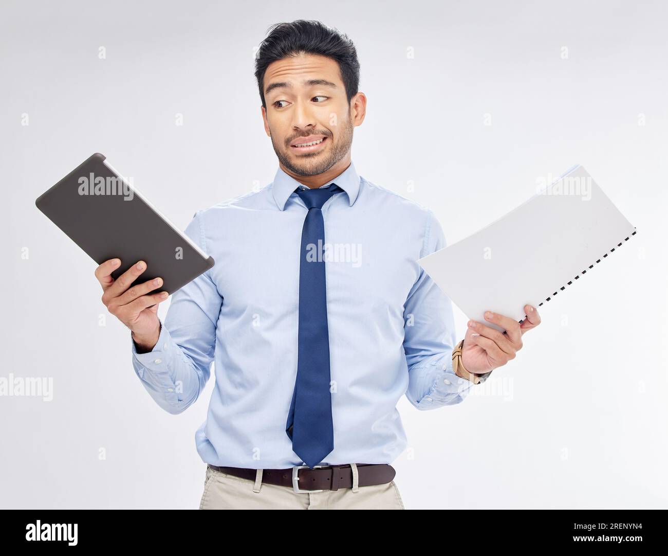 Choice of print vs digital by businessman with paperwork for corporate ...