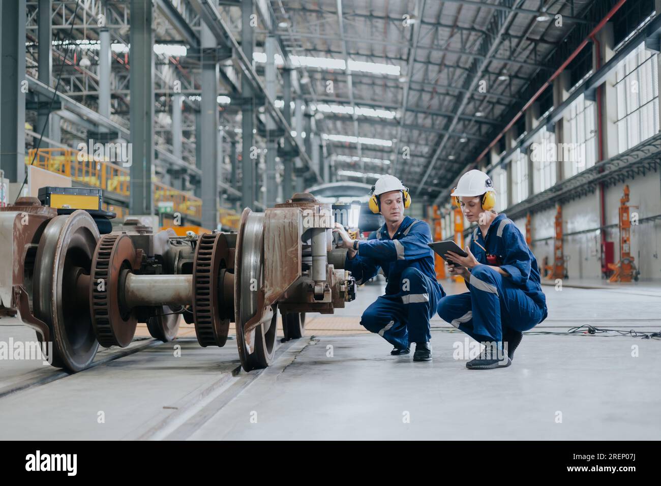 Engineer team working maintenance service fix replace train wheel in ...
