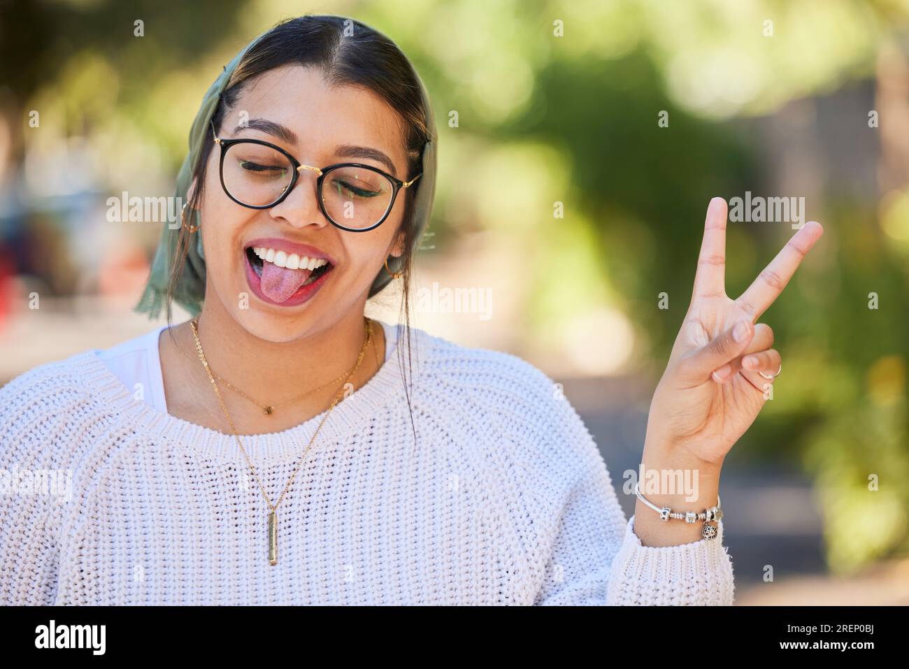 Peace sign, woman and outdoor with a smile of student on summer holiday ...