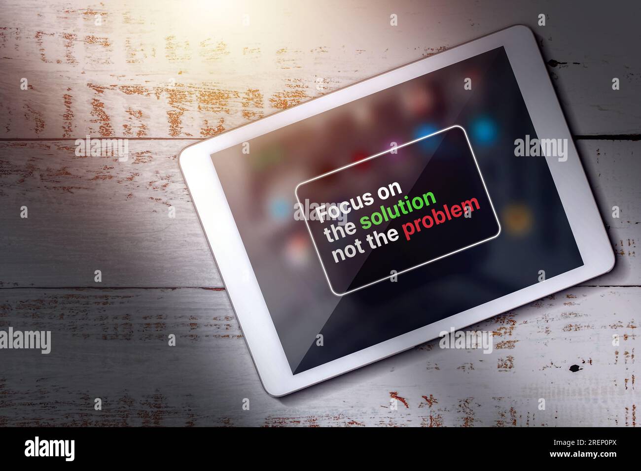 Motivational quote on digital tablet screen - Focus on the solution not ...