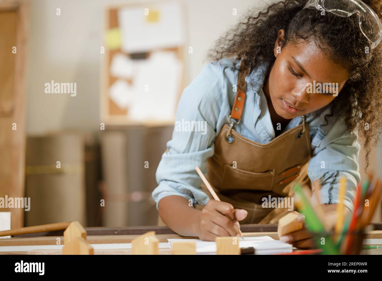 Smart woman carpenter joiner wooden home furniture work sketch design ...