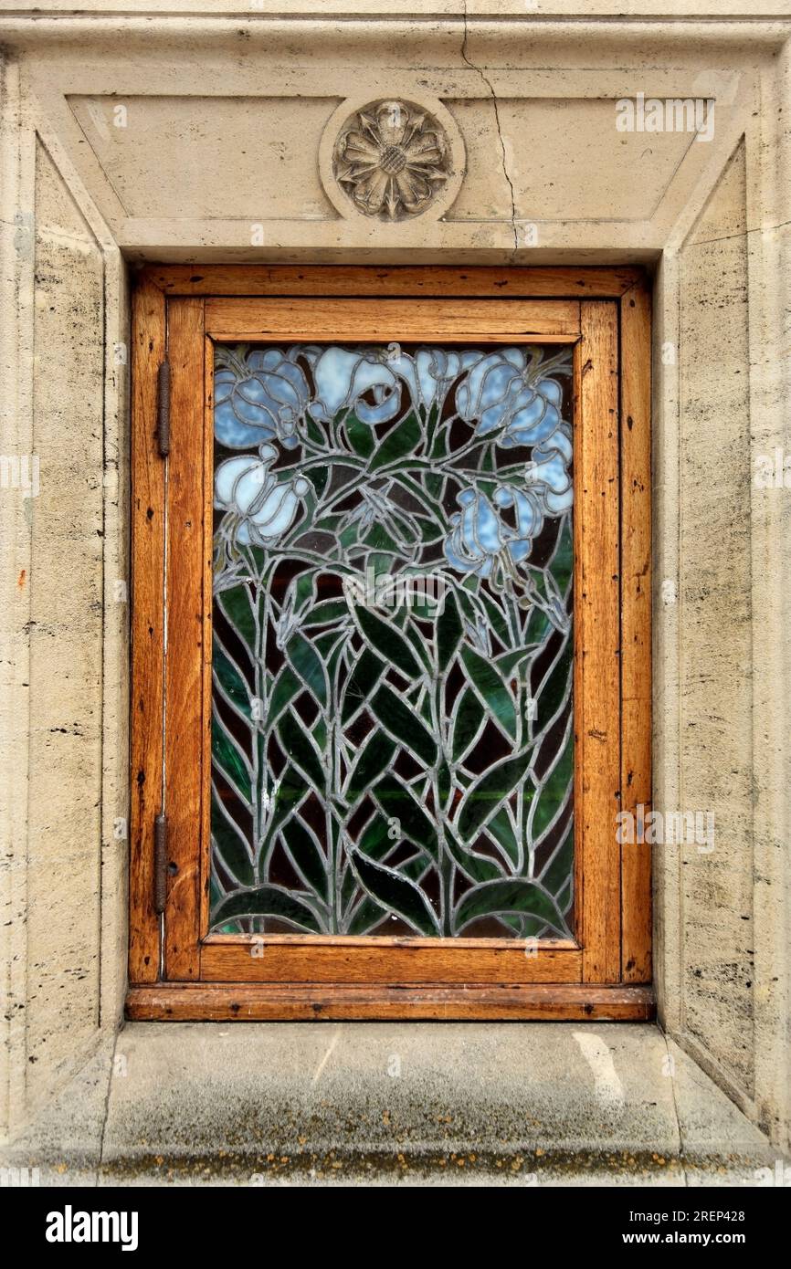Small stained glass window with a floral design in the Art Nouveau 19th ...