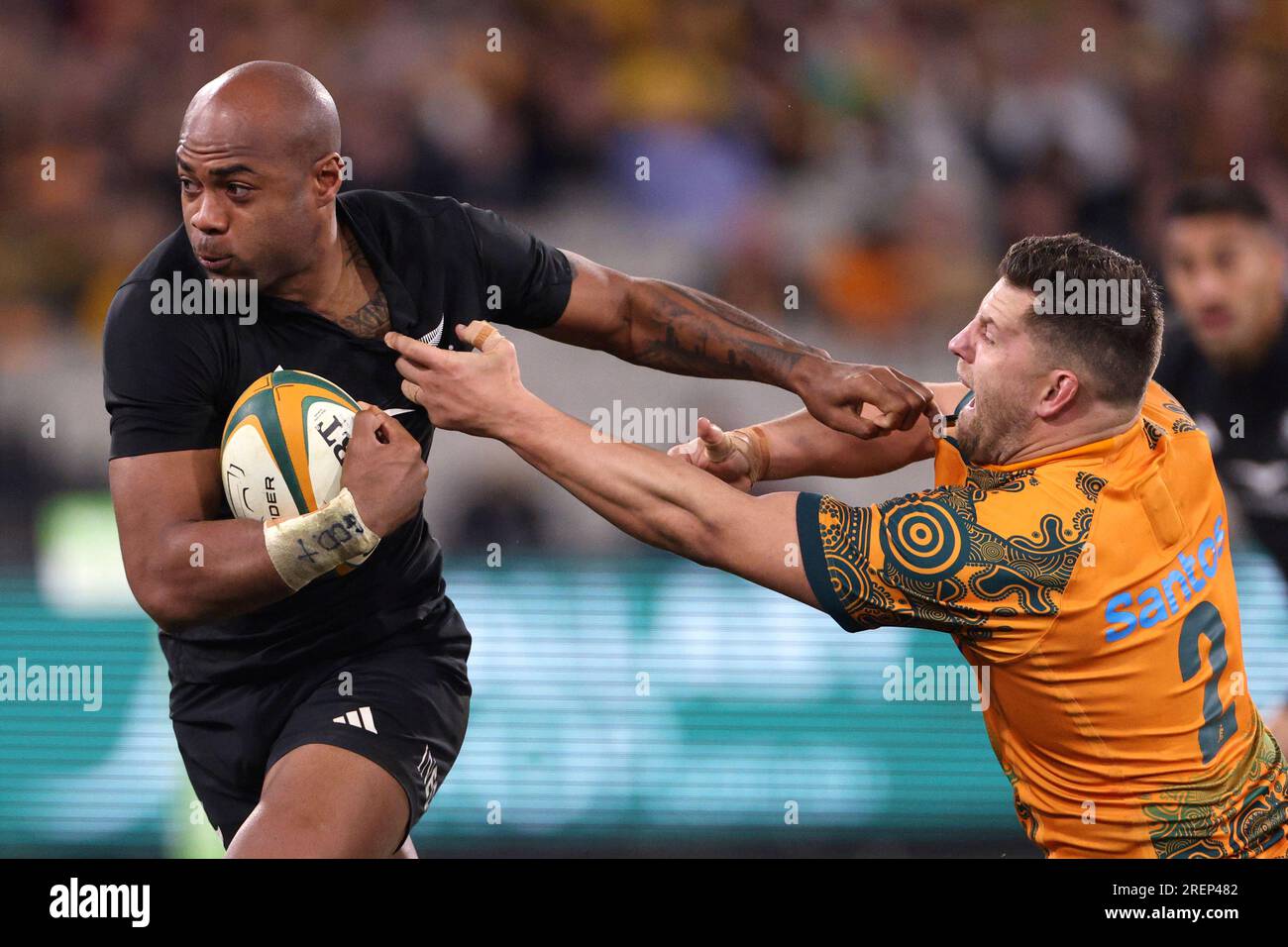 New Zealand's Mark Telea, left, fends off Australia's Dave Porecki ...