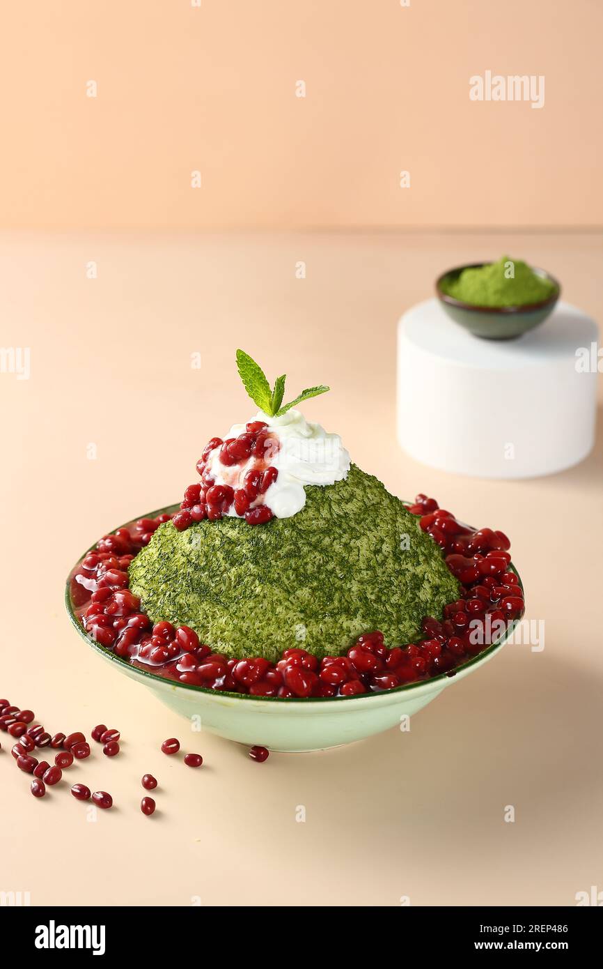 Korean shaved ice dessert with sweet toppings, matcha red beans Bingsu ...