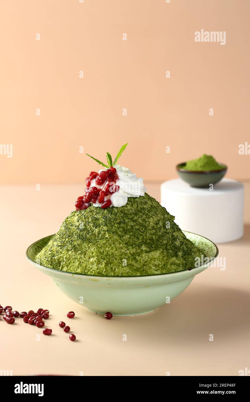 Korean shaved ice dessert with sweet toppings, matcha red beans Bingsu ...