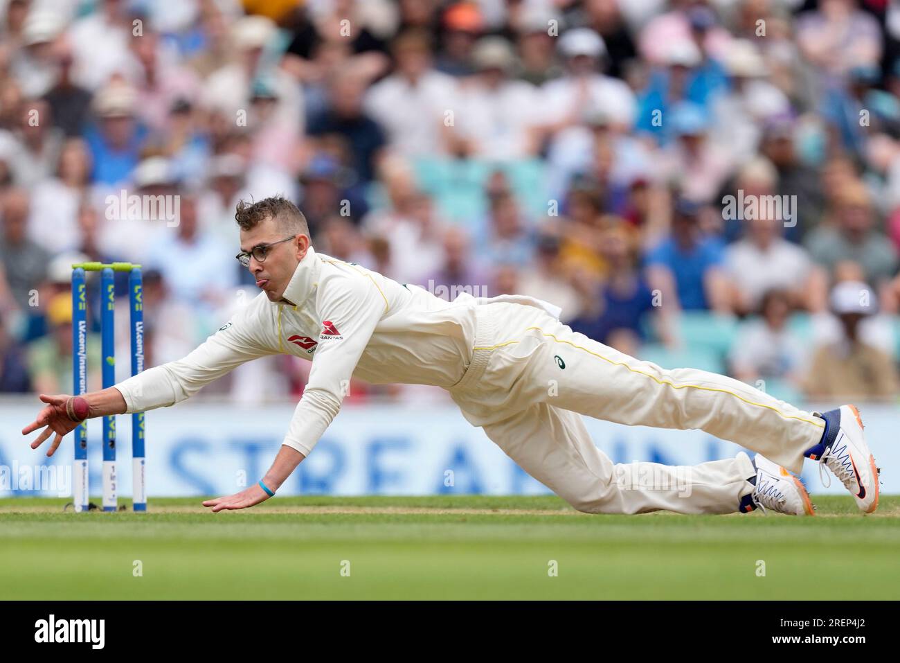 Australia's Todd Murphy fields the ball after bowling on day three of ...