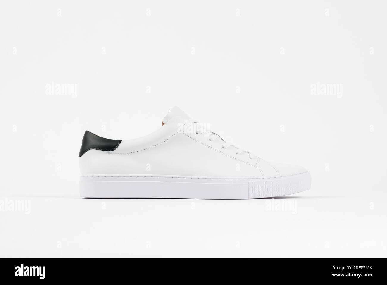 White sneaker product shot. Classic white sneakers side view Stock ...