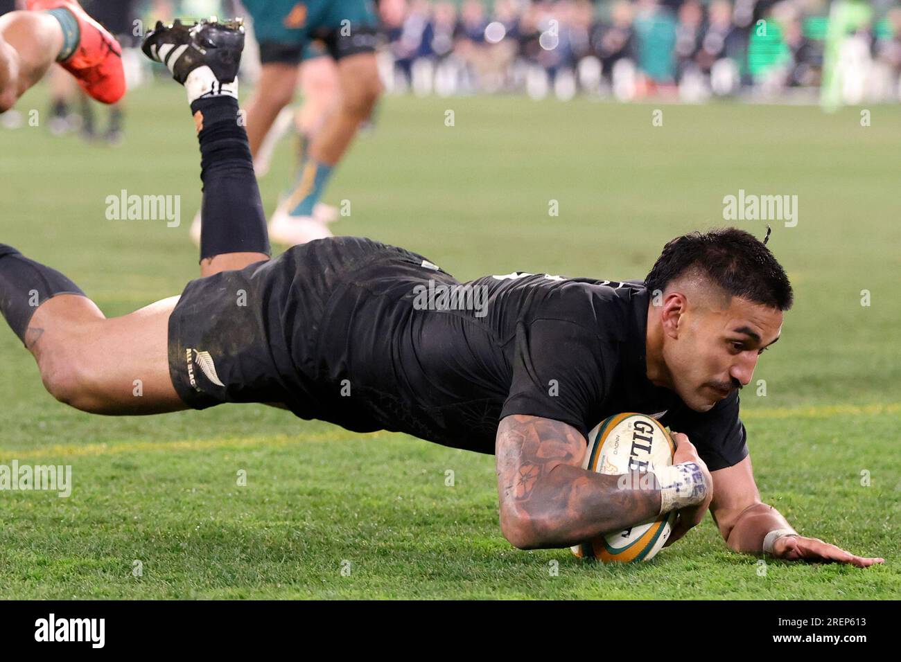 New Zealand's Rieko Ioane scores a try against Australia during their ...