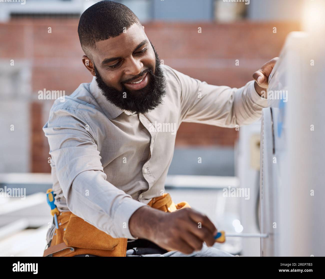 Building, engineer and air conditioner install with a black man on a ...