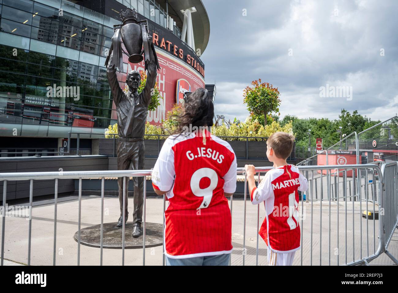 London, UK. 29 July 2023. Fans view the statue of Arsenal manager ...
