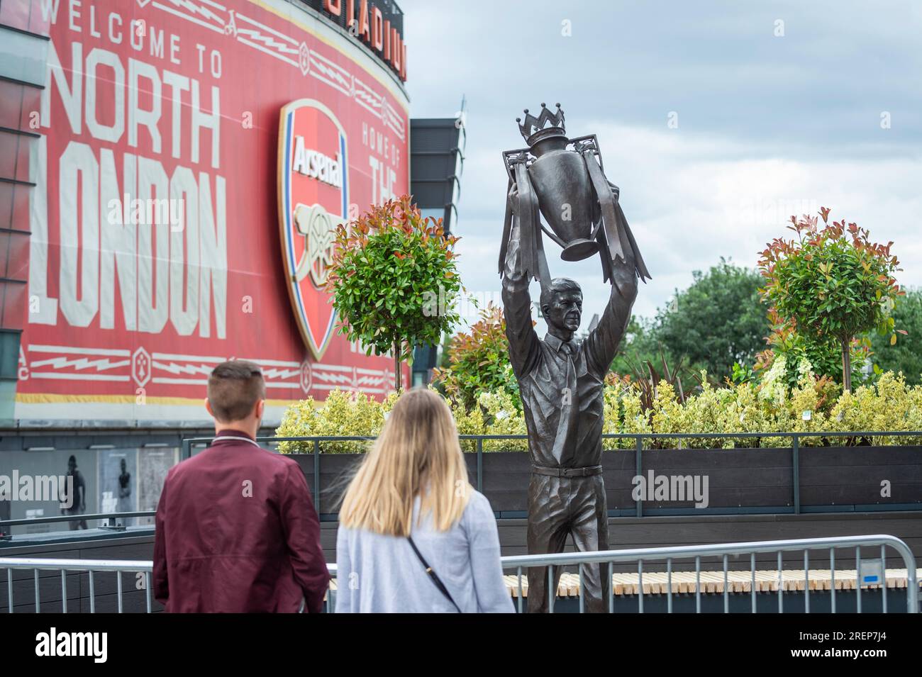 London, UK. 29 July 2023. Fans view the statue of Arsenal manager ...