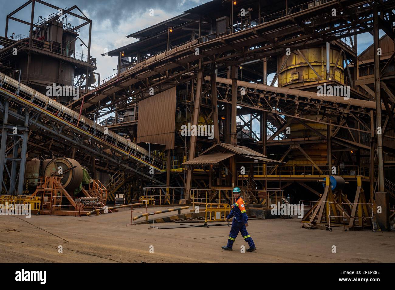Soroako, Indonesia. 28th July, 2023. A worker walks in front of nickel ...