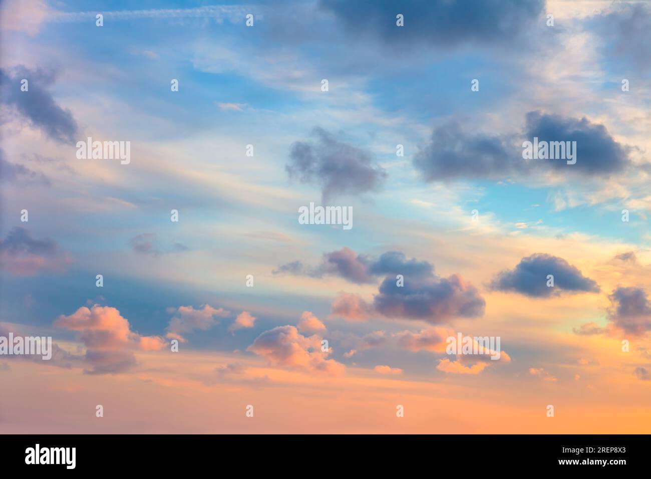 Real gentle sunrise against the sky with pastel colorful clouds ...