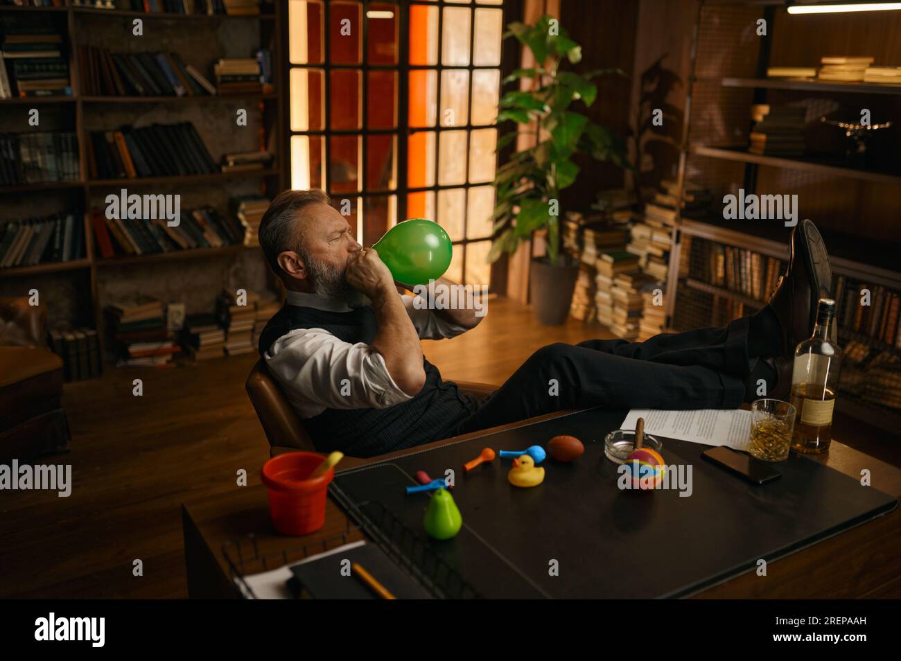 Man blowing up balloon hi-res stock photography and images - Alamy