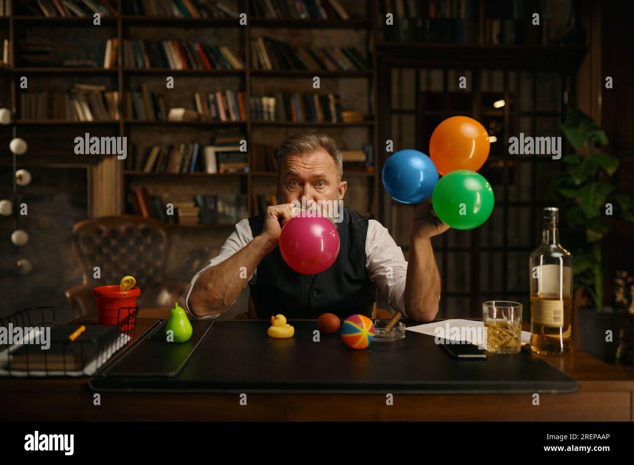 Man blowing up balloon hi-res stock photography and images - Alamy