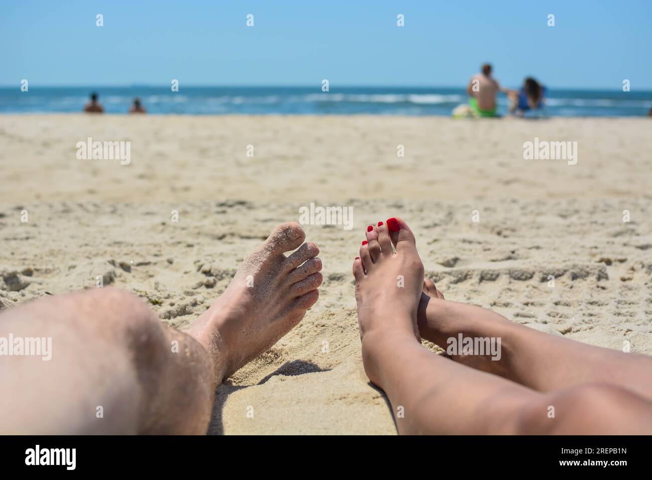 Multi culture couple feet on the beach copy space vacation theme Stock ...