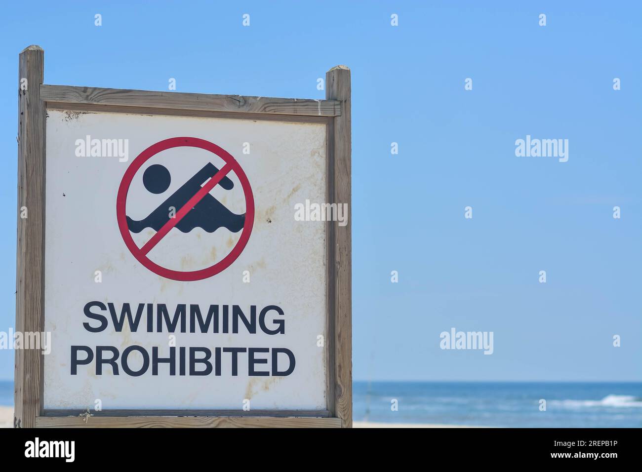 Swimming prohibited beach sign, warning copy space image Stock Photo ...