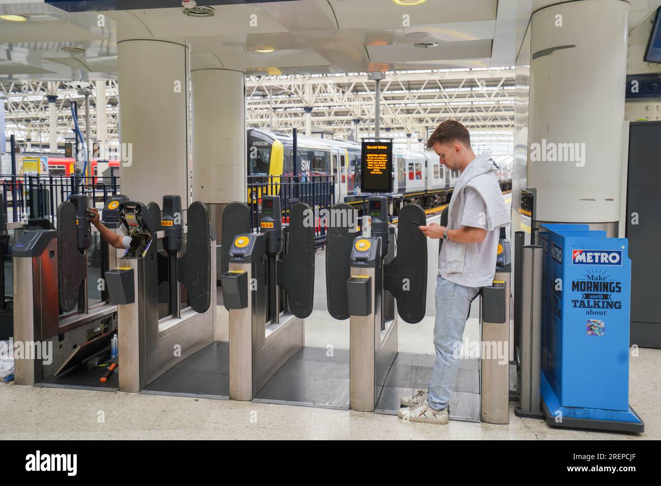 London UK. 29 July 2023 Passengers at Waterloo station face travel ...